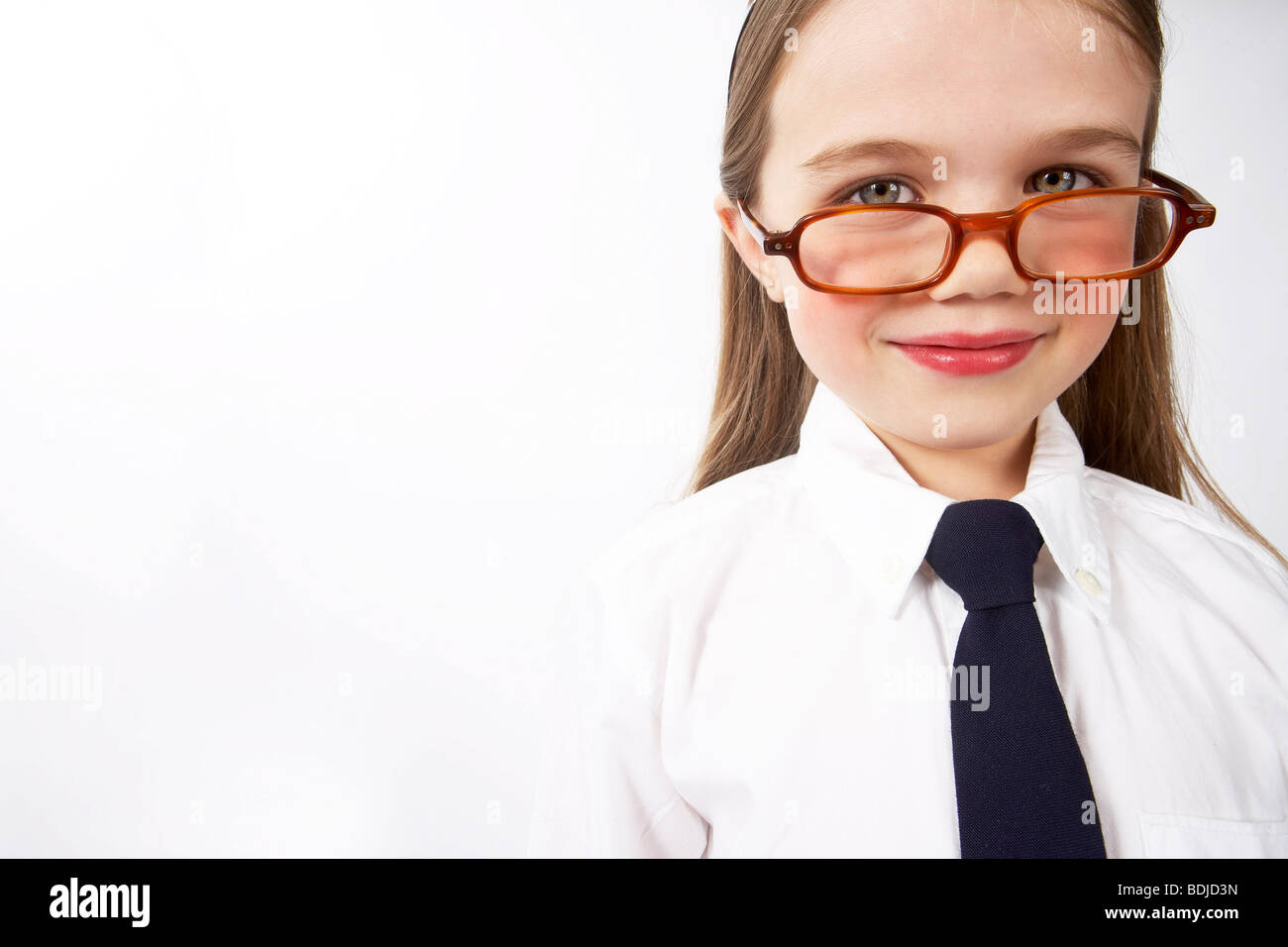 Girl Looking over Glasses Stock Photo - Alamy