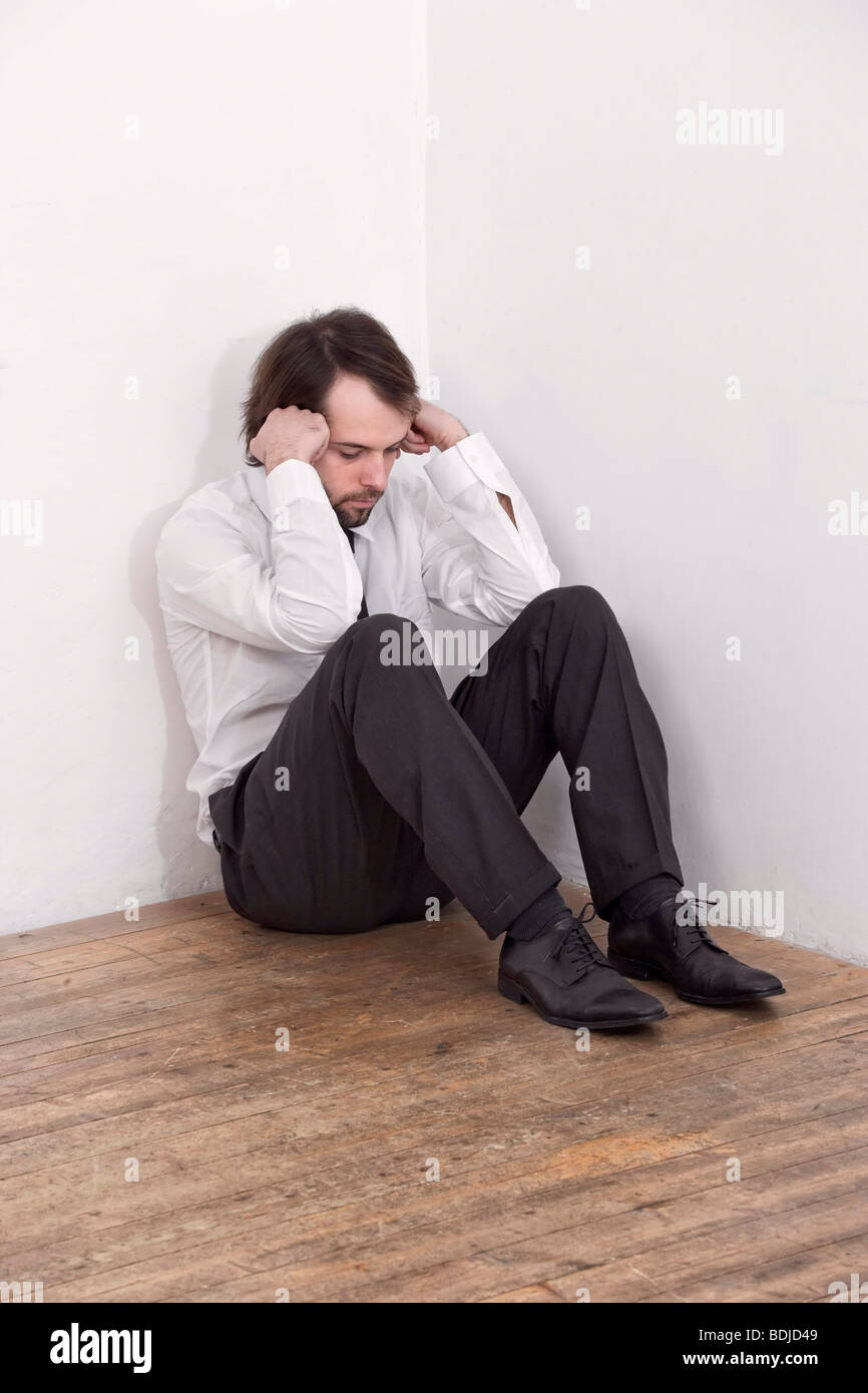 Depressed Man Sitting Alone In High Resolution Stock Photography and ...