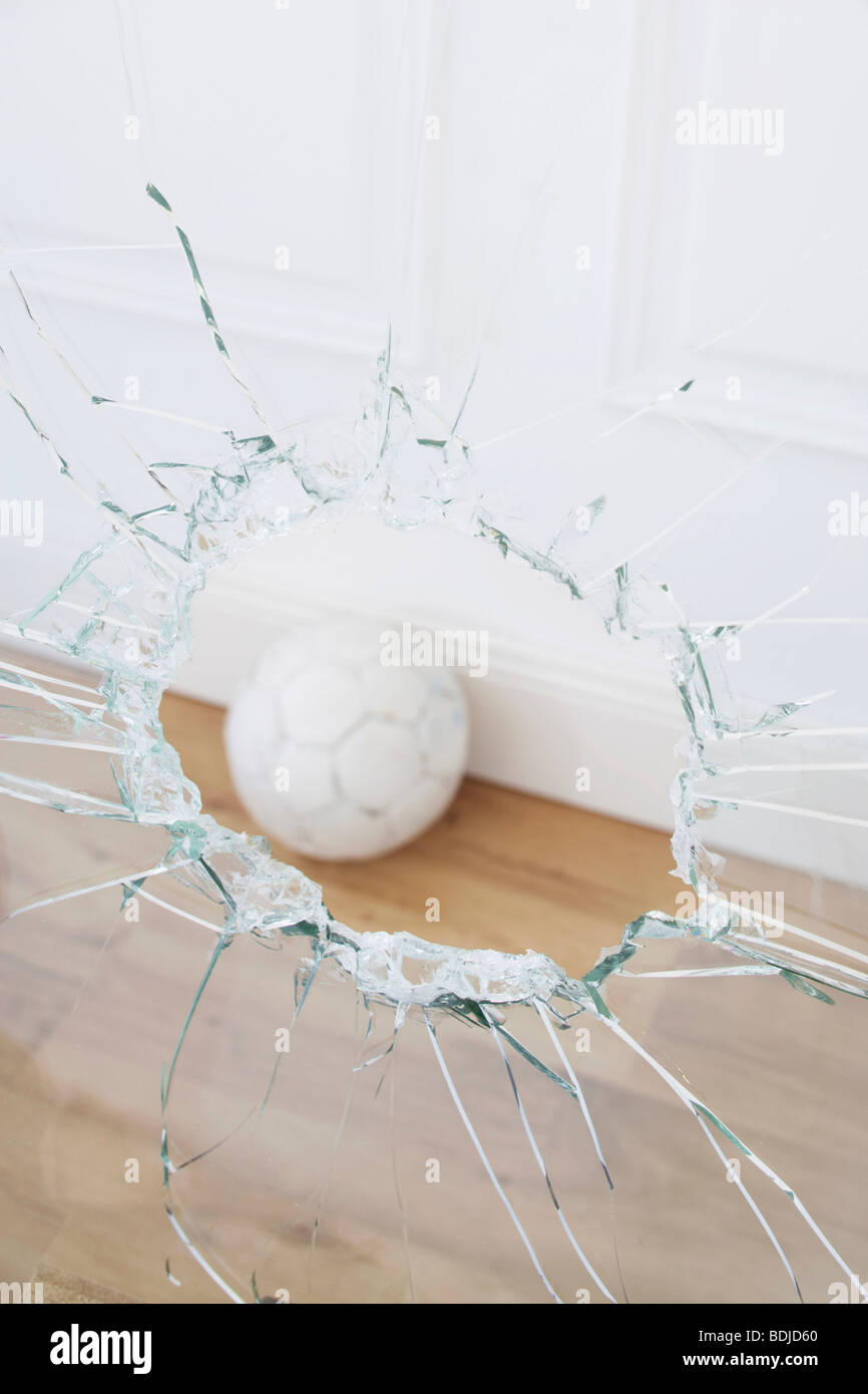 Broken window ball hi-res stock photography and images - Alamy