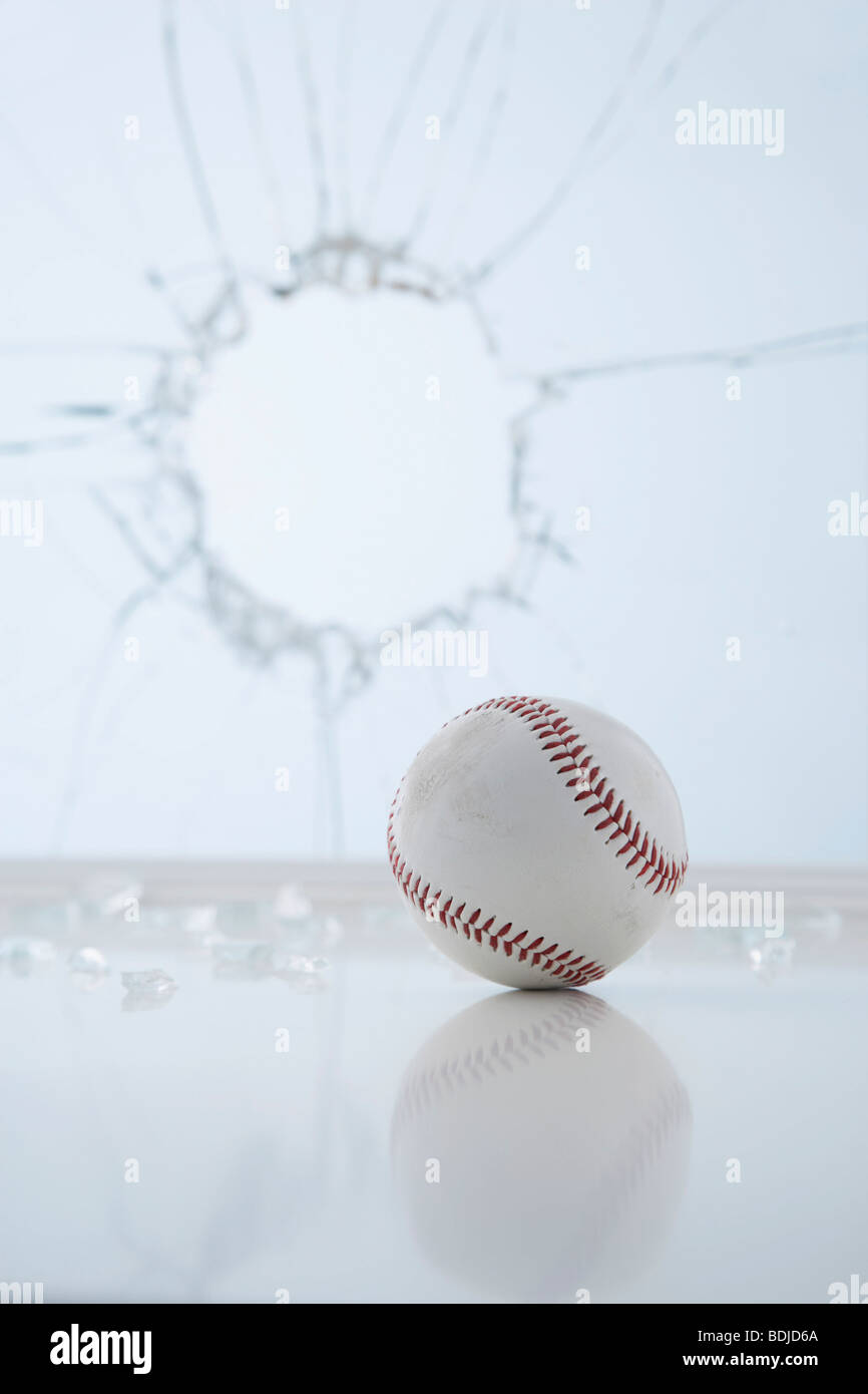 Broken Window and Baseball Stock Photo - Alamy