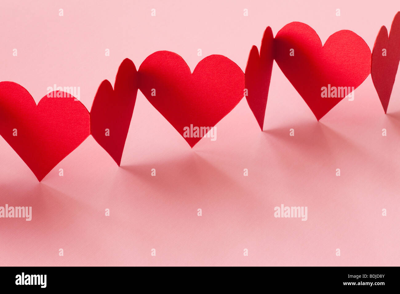 Paper doll chain hi-res stock photography and images - Alamy