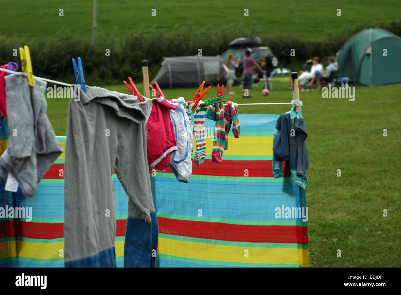 Clothes hanging on a washing line at a campsite Stock Photo - Alamy