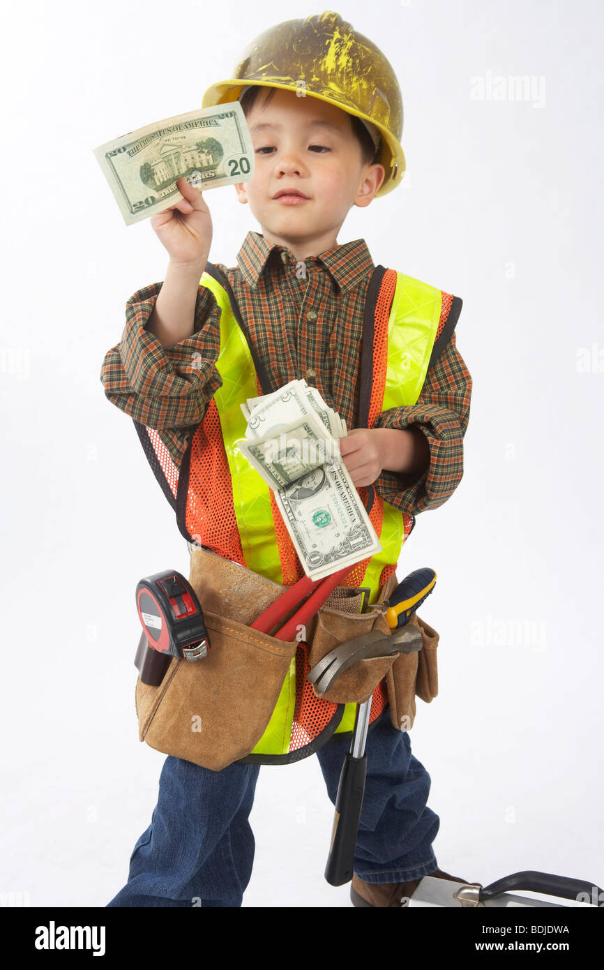 Boy Dressed Up as Construction Worker Holding Money Stock Photo - Alamy