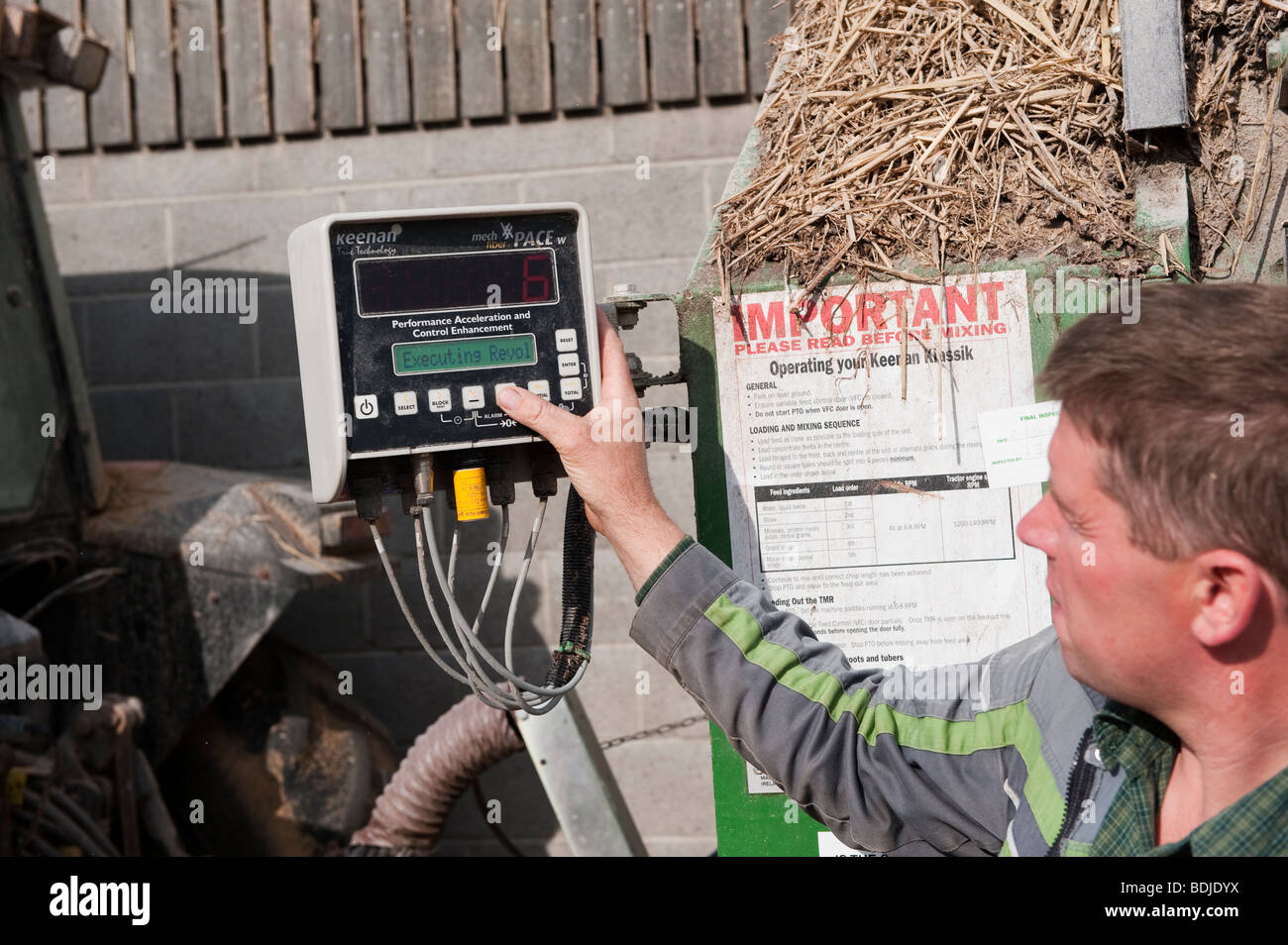 Putting inputs on a Livestock feed mix wagon Stock Photo - Alamy Putting inputs on a Livestock feed mix wagon Stock Photo - Alamy