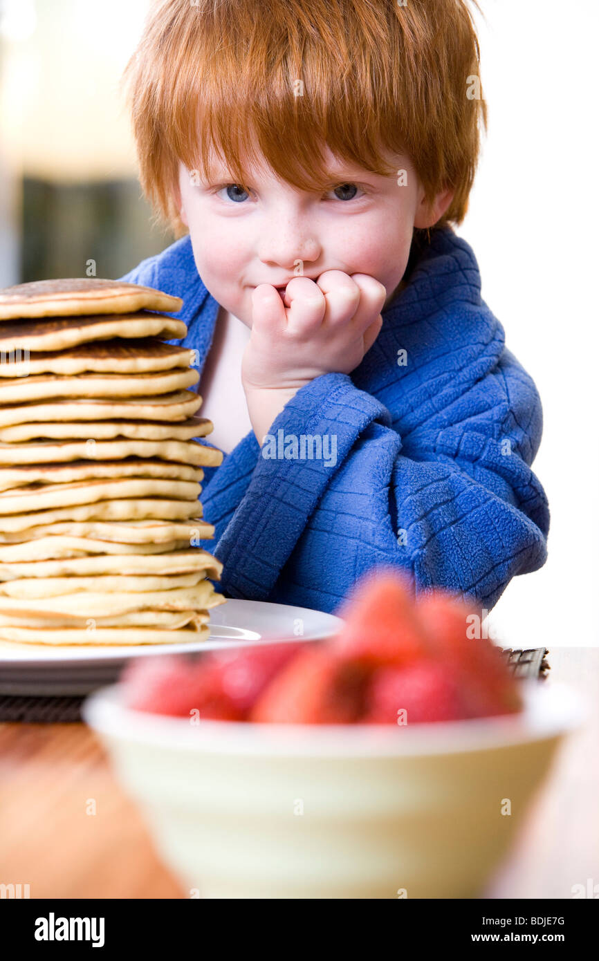 Boy Eating Pancakes Village Boy Eating Pancakes With Wooden Fork In An