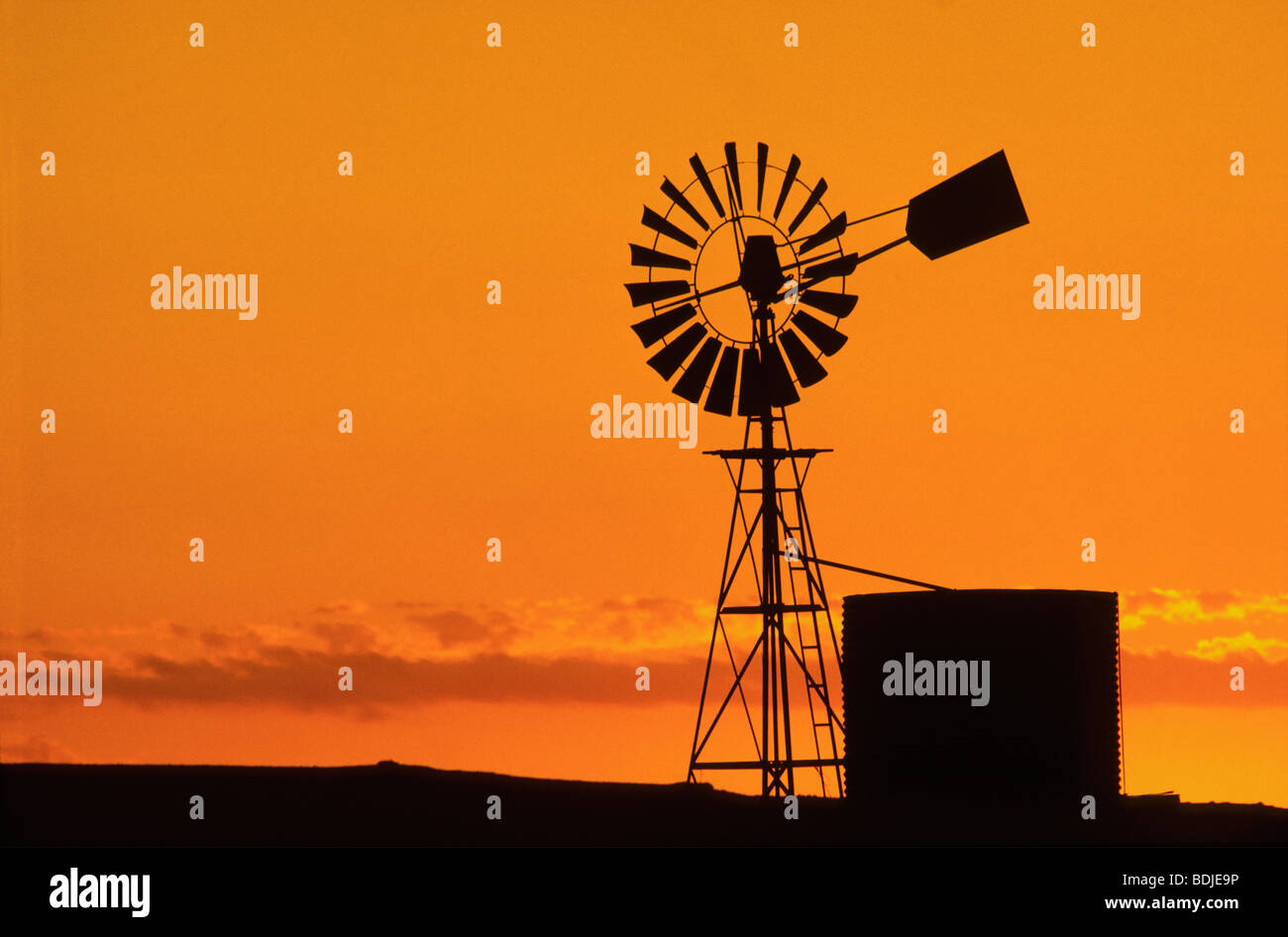 Windmill, Water Tank, Sunset Silhouette Stock Photo - Alamy
