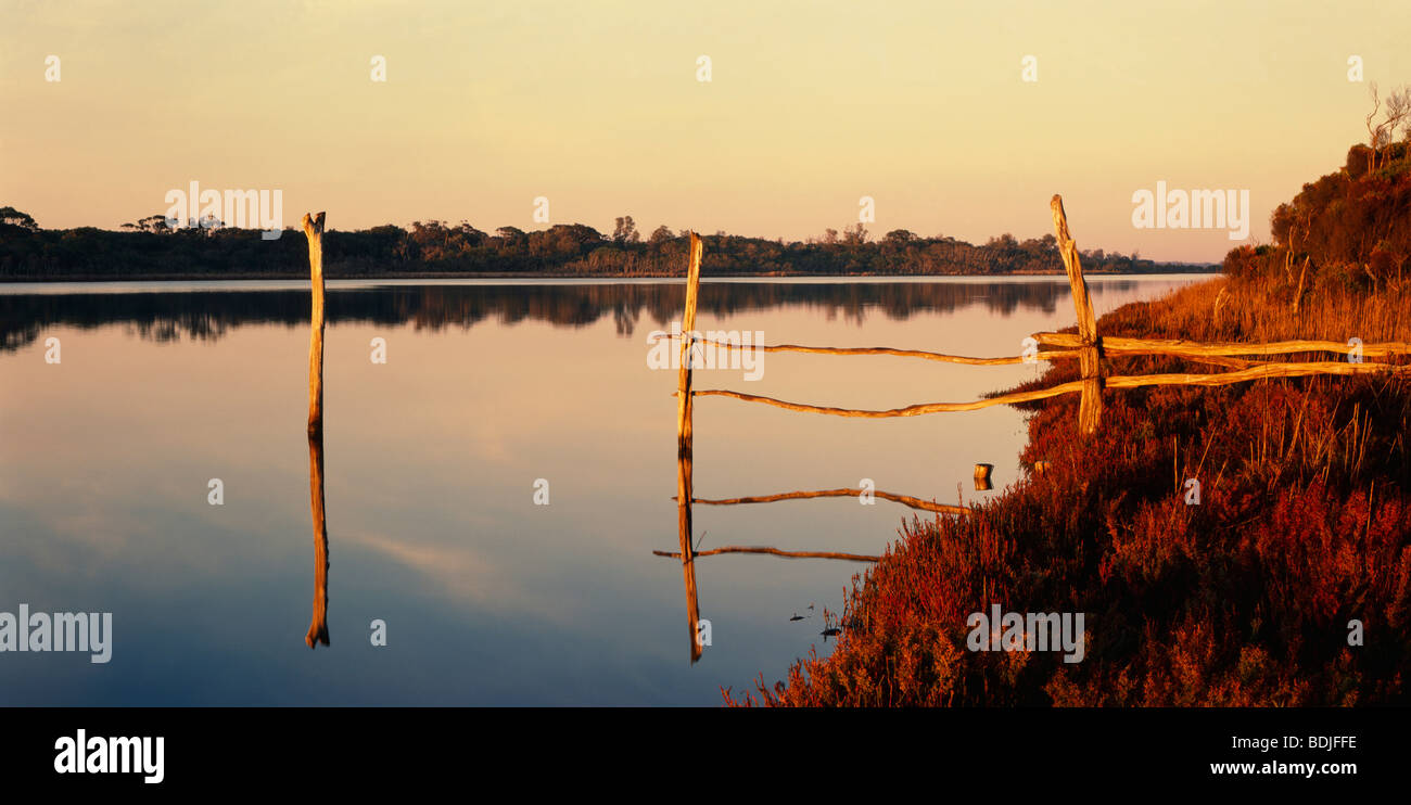 Fence and Lake, Sunrise Stock Photo - Alamy