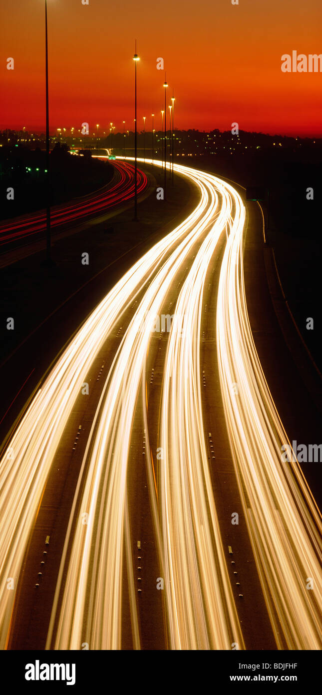 Freeway at Sunset Showing Car Headlight Trails Stock Photo - Alamy