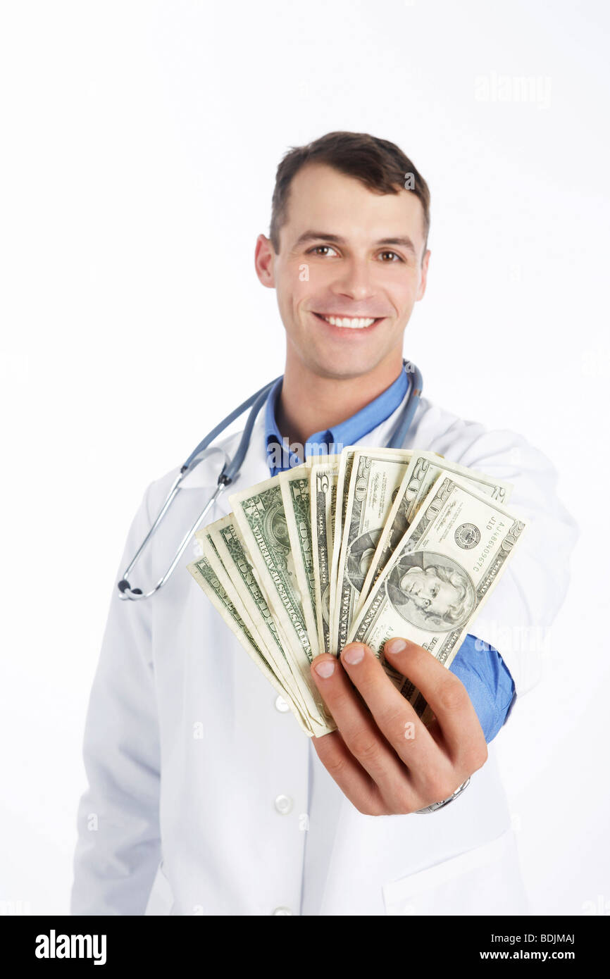Doctor Holding Cash Stock Photo - Alamy