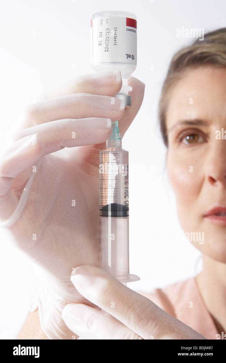 Nurse Preparing a Needle Stock Photo - Alamy