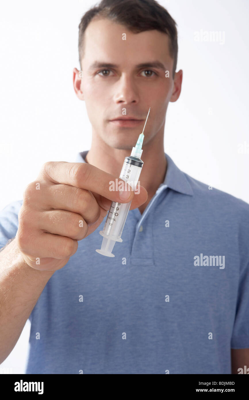 Man Holding Needle Stock Photo - Alamy