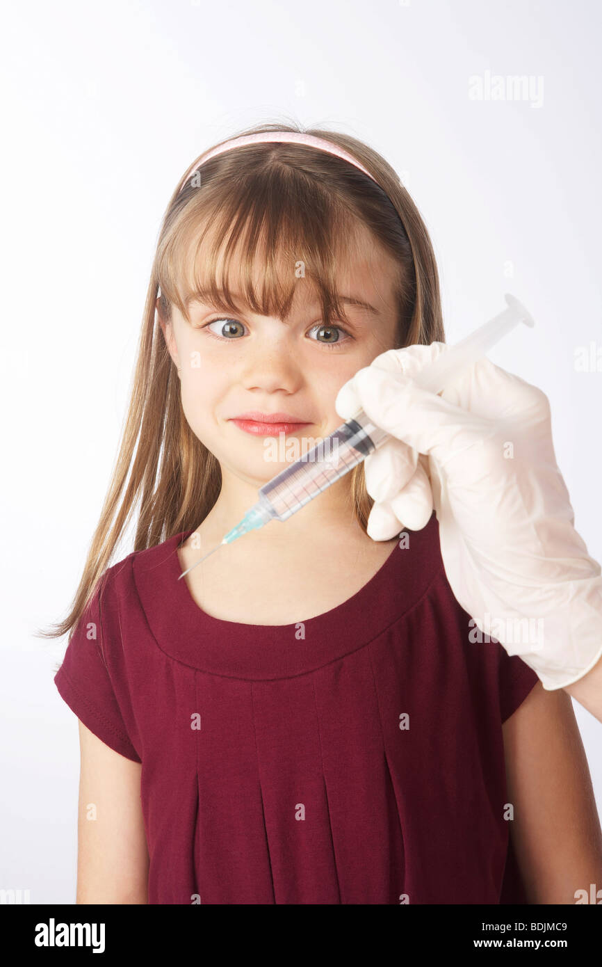 Girl About to Get a Needle Stock Photo - Alamy