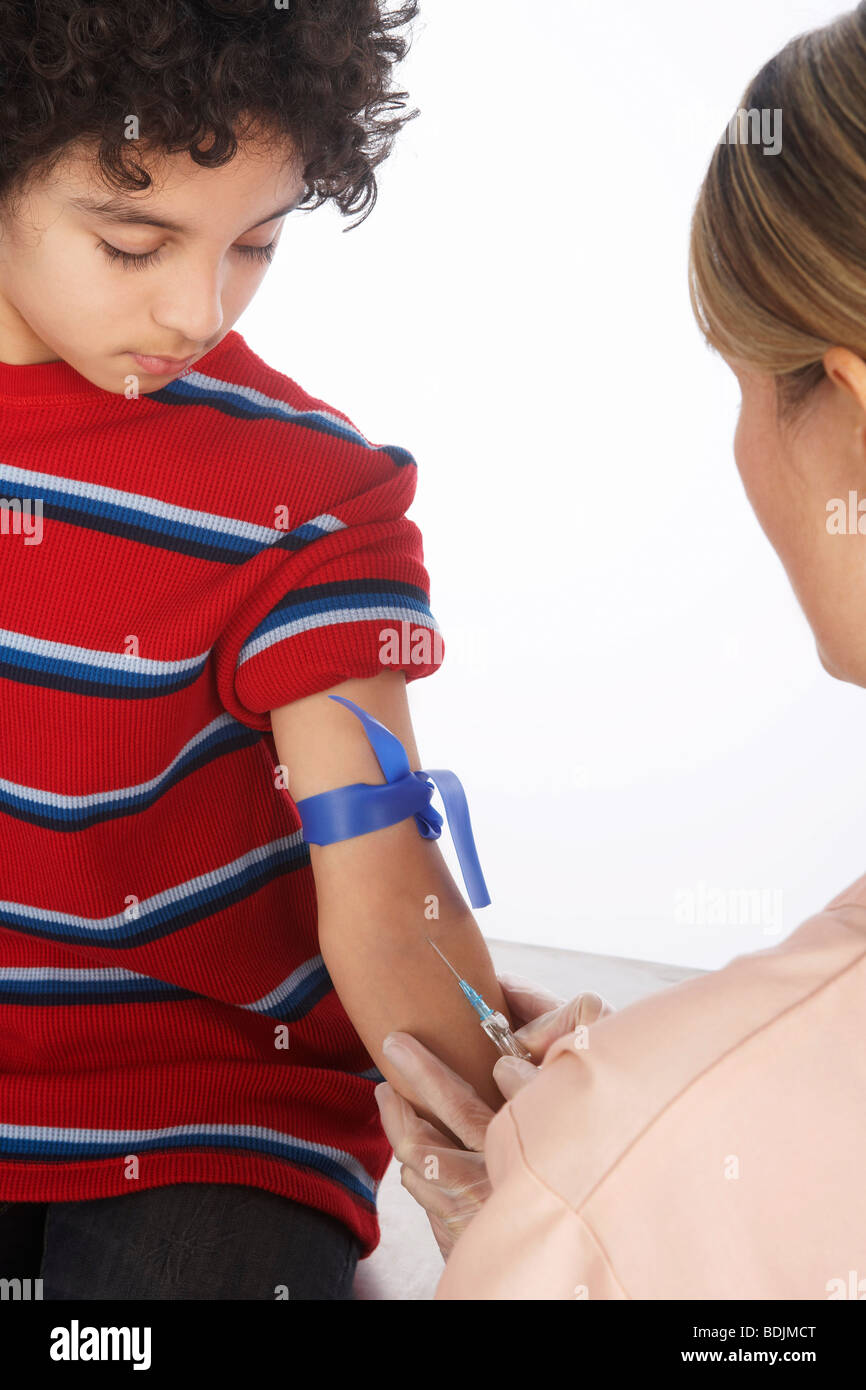 Boy Getting a Needle Stock Photo - Alamy