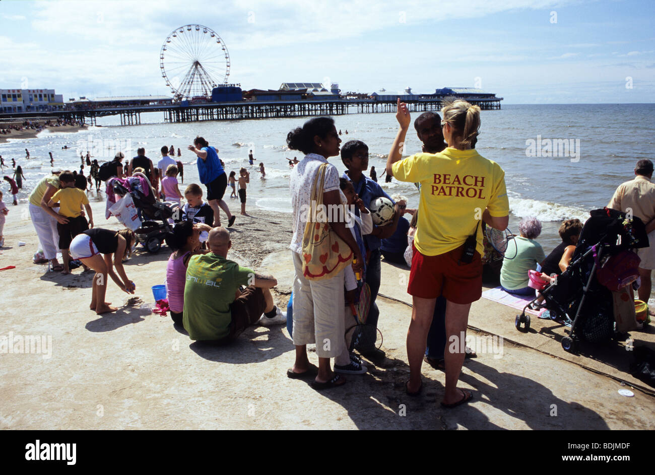 Beach Patrol Life Guard Advising Holiday Makers On Blackpool Beach ...