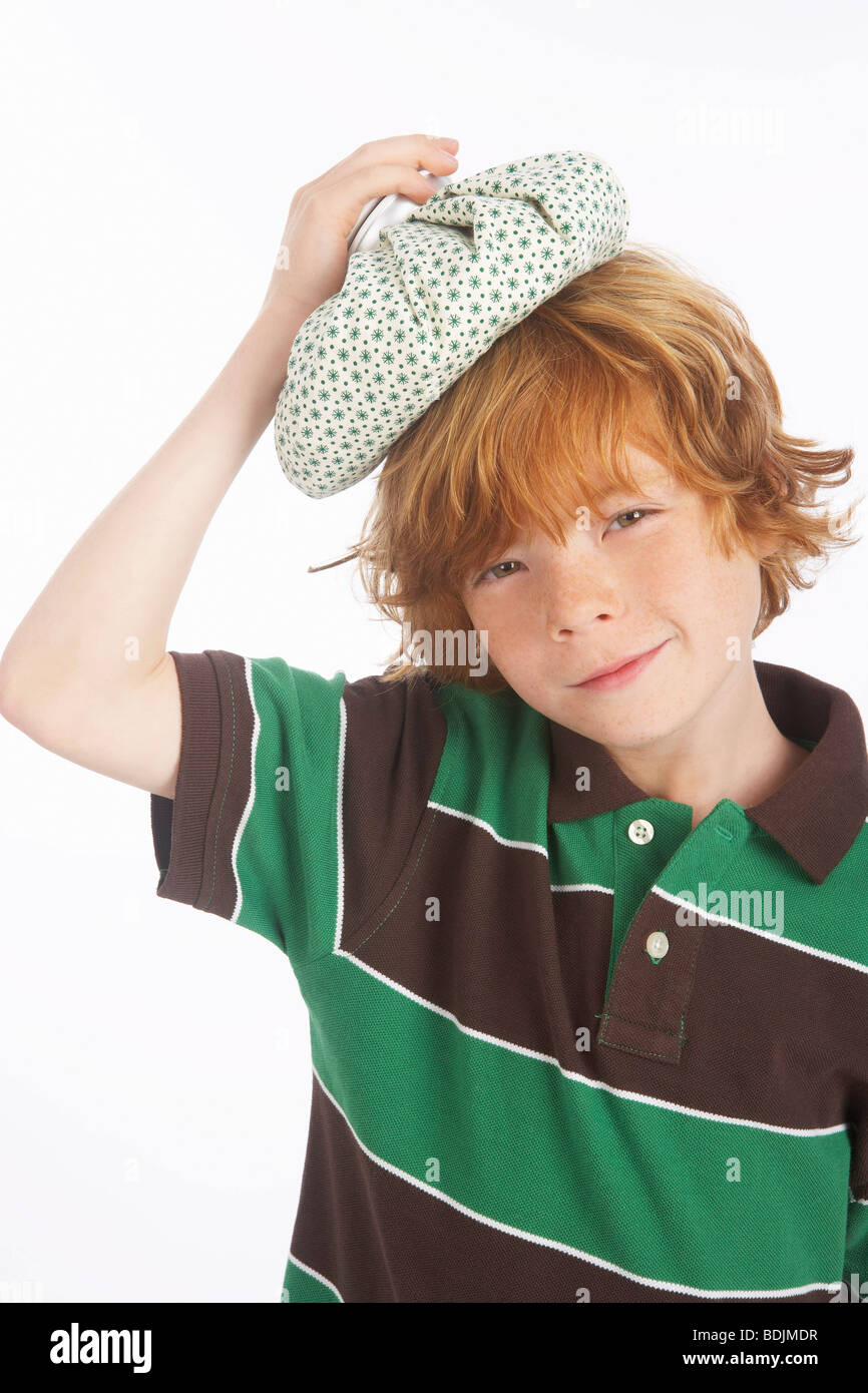 Boy Holding an Ice Pack on His Head Stock Photo - Alamy