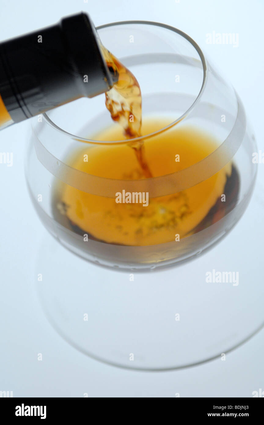 Pouring glass of Martell Cognac Stock Photo - Alamy