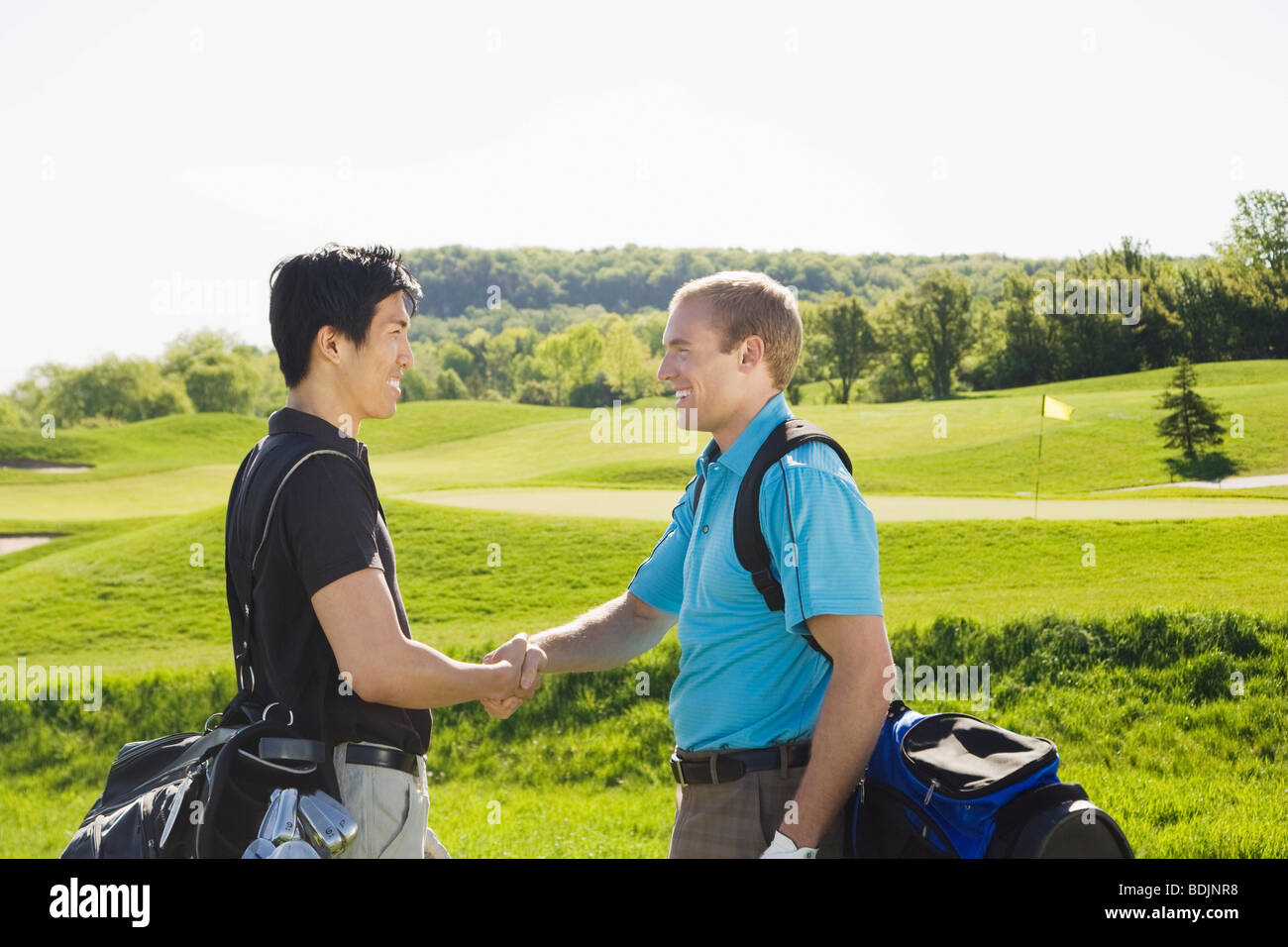 Men at Golf Course Stock Photo - Alamy
