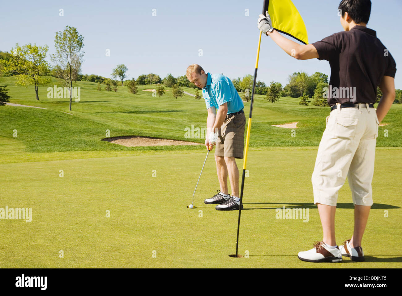Men Playing Golf Stock Photo - Alamy