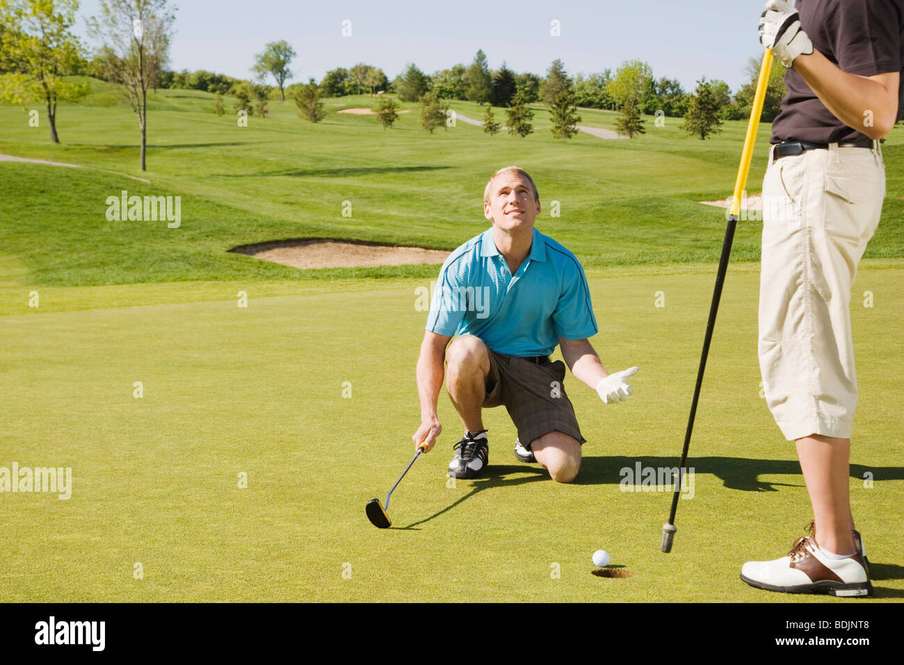 Men Playing Golf Stock Photo - Alamy