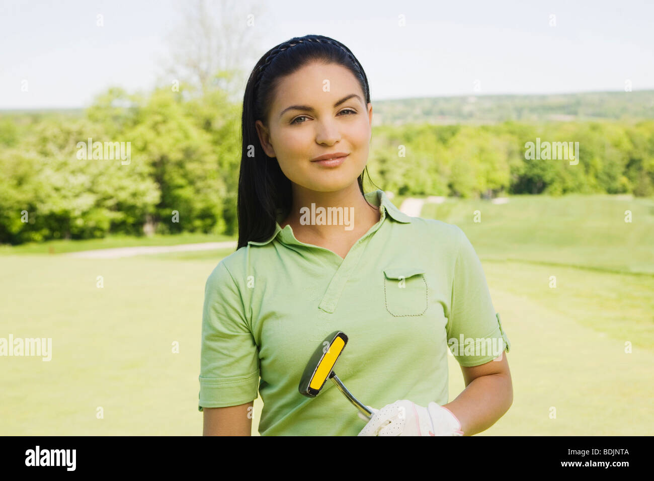 Woman at Golf Course Stock Photo - Alamy