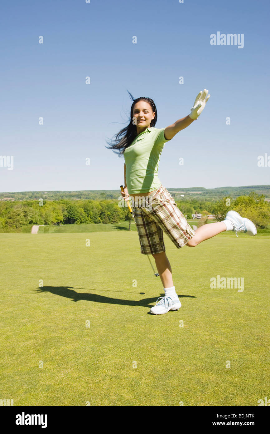 Woman at Golf Course Stock Photo - Alamy
