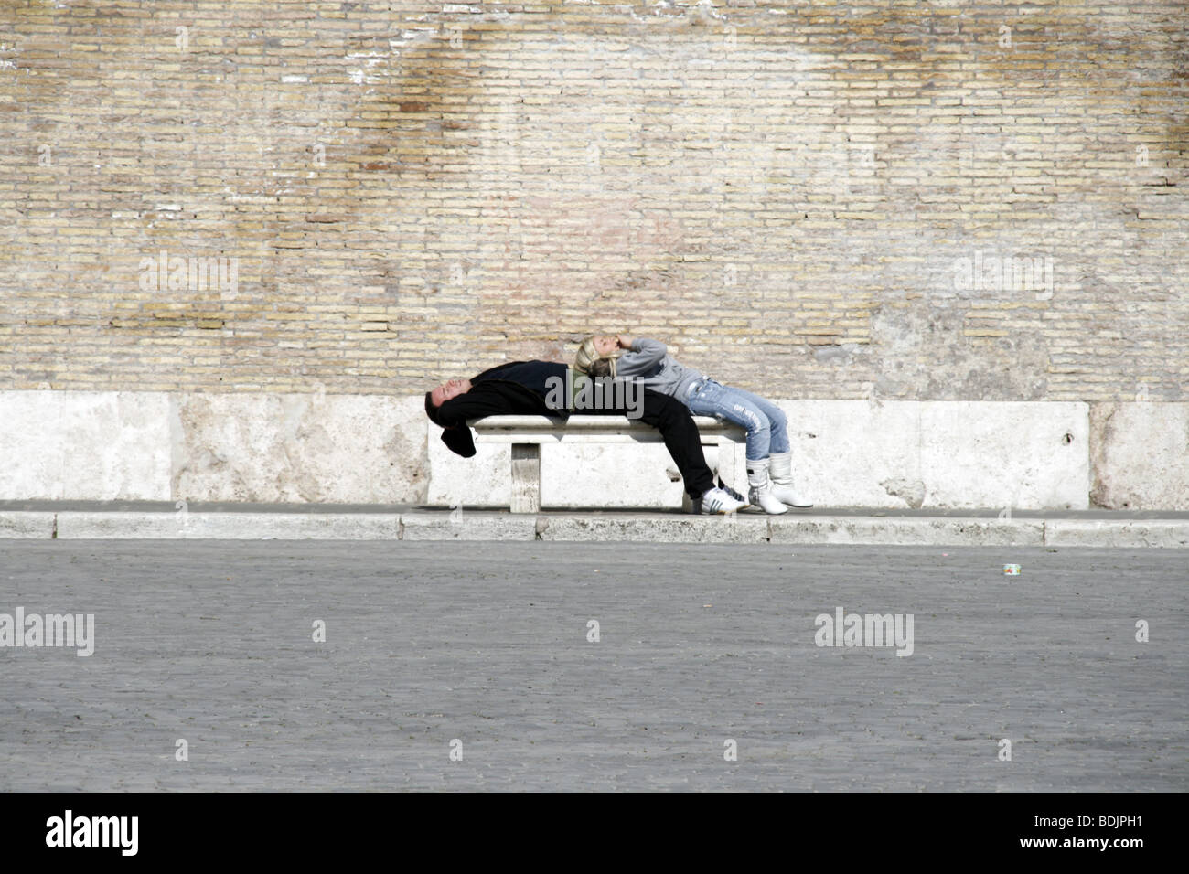 Young couple sleeping on bench hi-res stock photography and images - Alamy