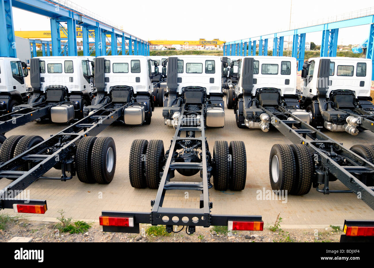 New lorries line a quayside Stock Photo - Alamy