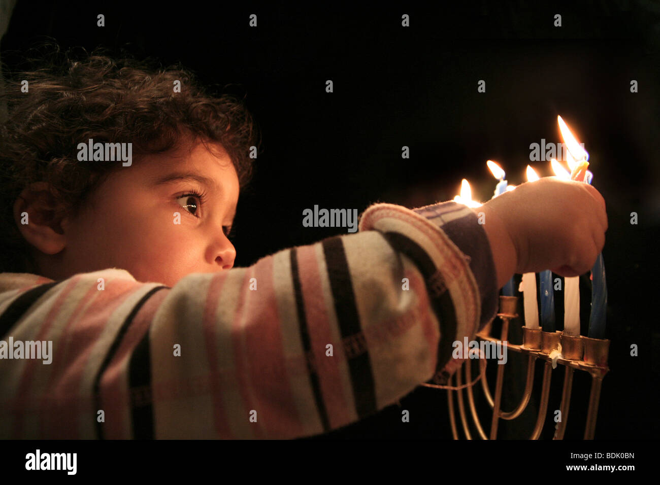 Child and menorah hi-res stock photography and images - Alamy