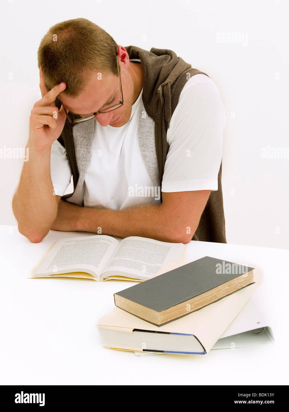 A young student working on his homework Stock Photo - Alamy