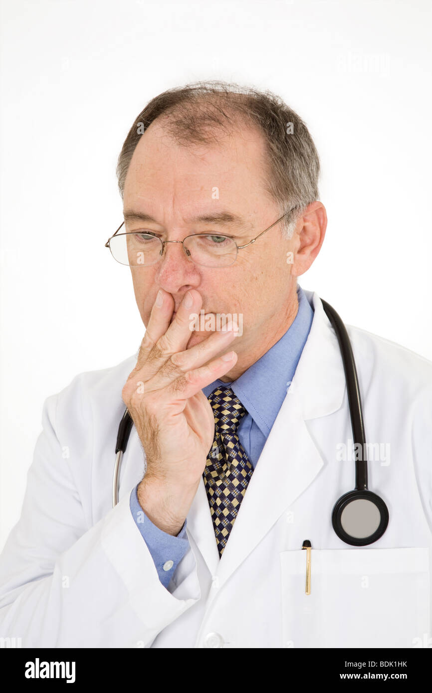 A caucasian doctor with a receding hairline wearing a white lab coat ...