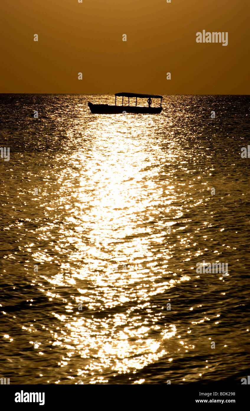 Fishing Boat at Sunset Stock Photo - Alamy