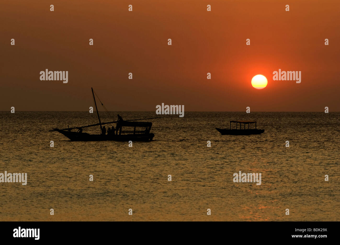Sail Boat at Sunset Stock Photo - Alamy