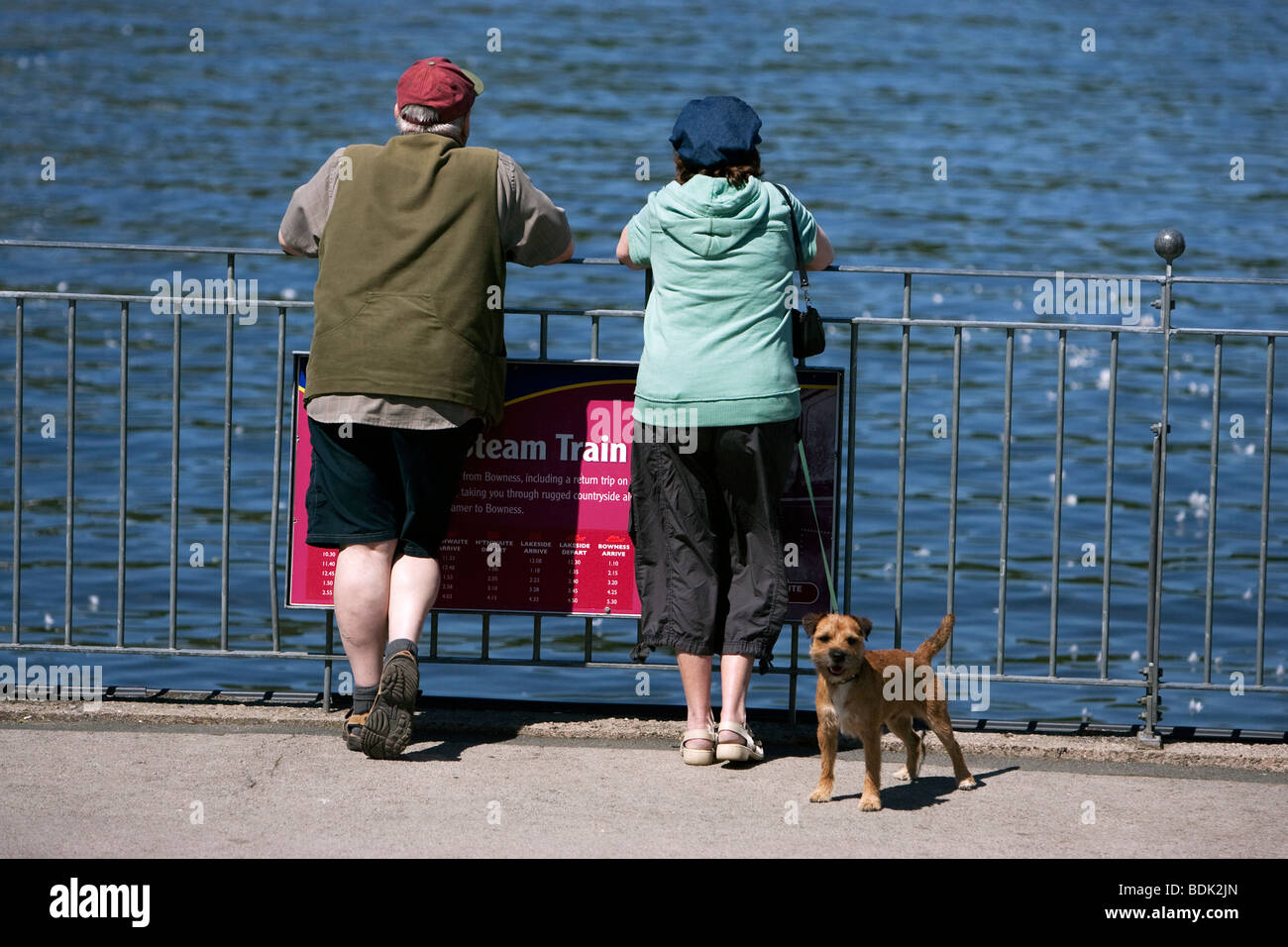 Couple looking over Lake Windermere Stock Photo - Alamy