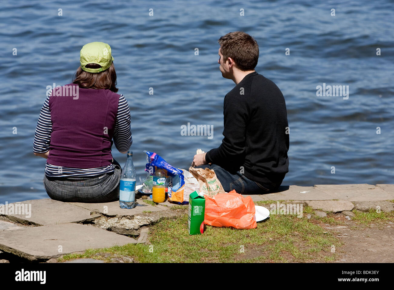 Couple looking over Lake Windermere Stock Photo - Alamy
