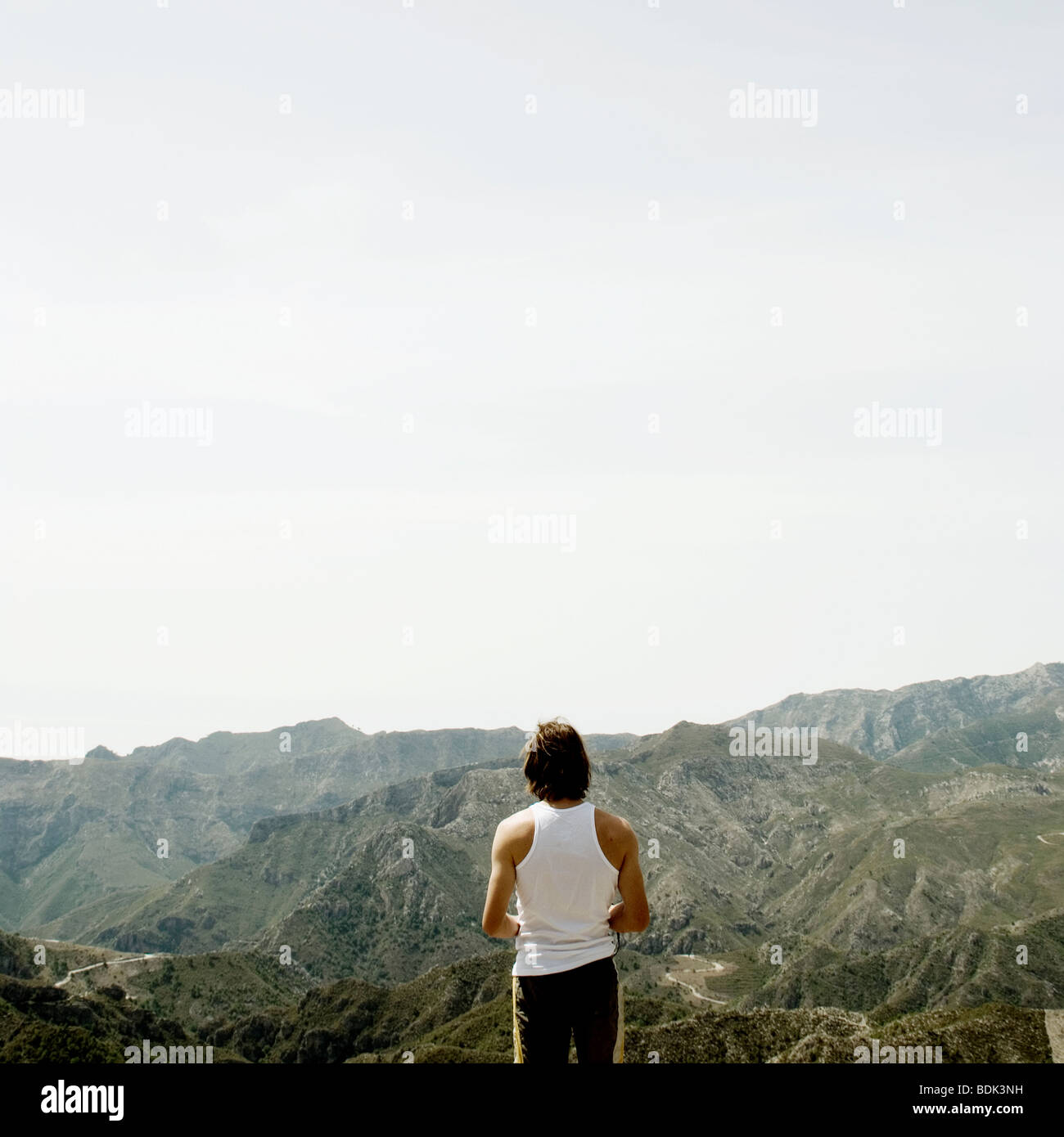 man looking out to mountains Stock Photo - Alamy