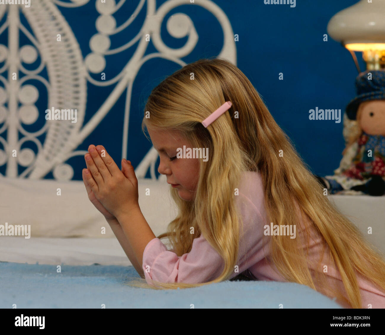 Girl saying bedtime prayers hi-res stock photography and images - Alamy