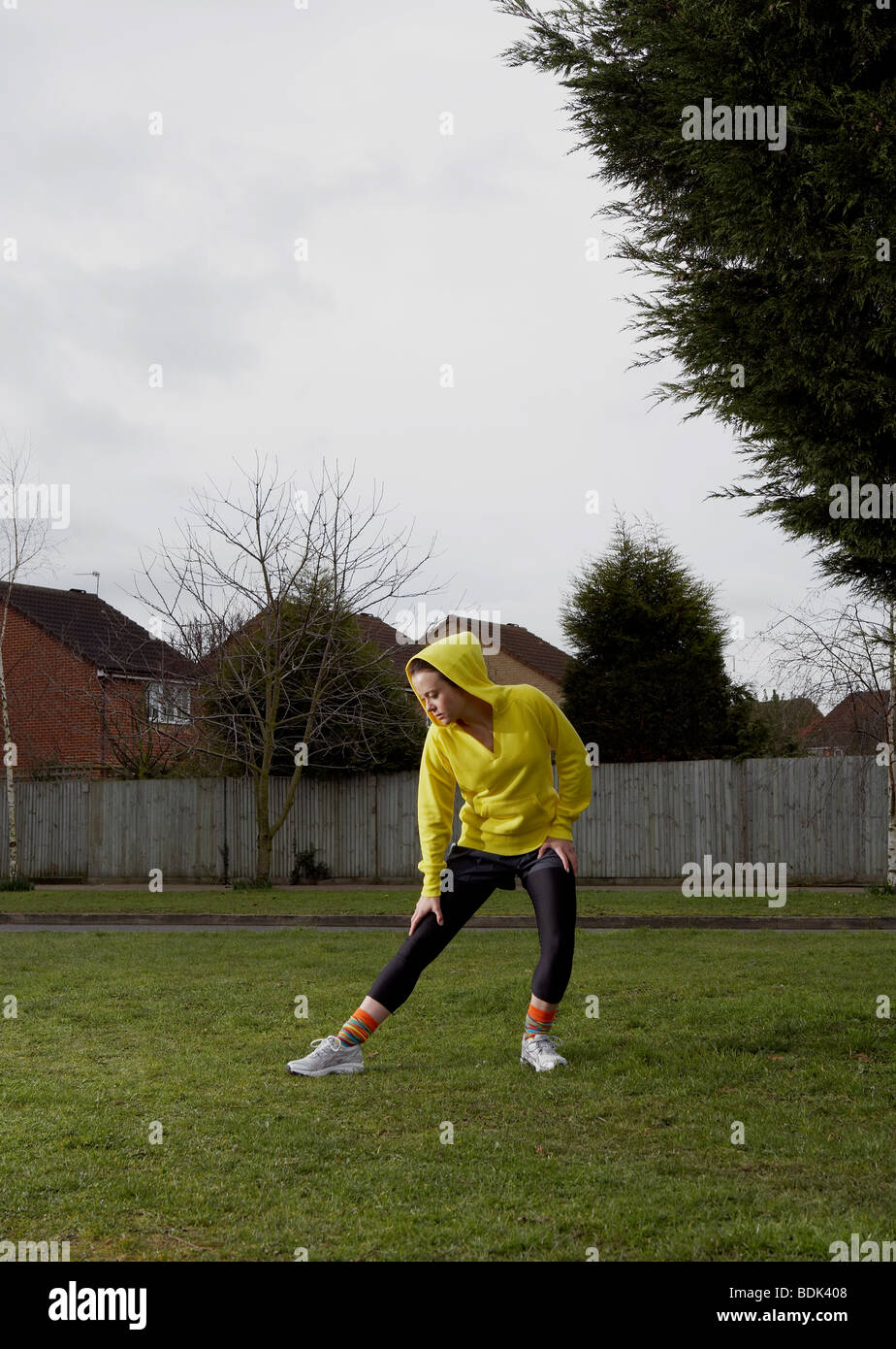 Female stretches before and after jogging Stock Photo - Alamy
