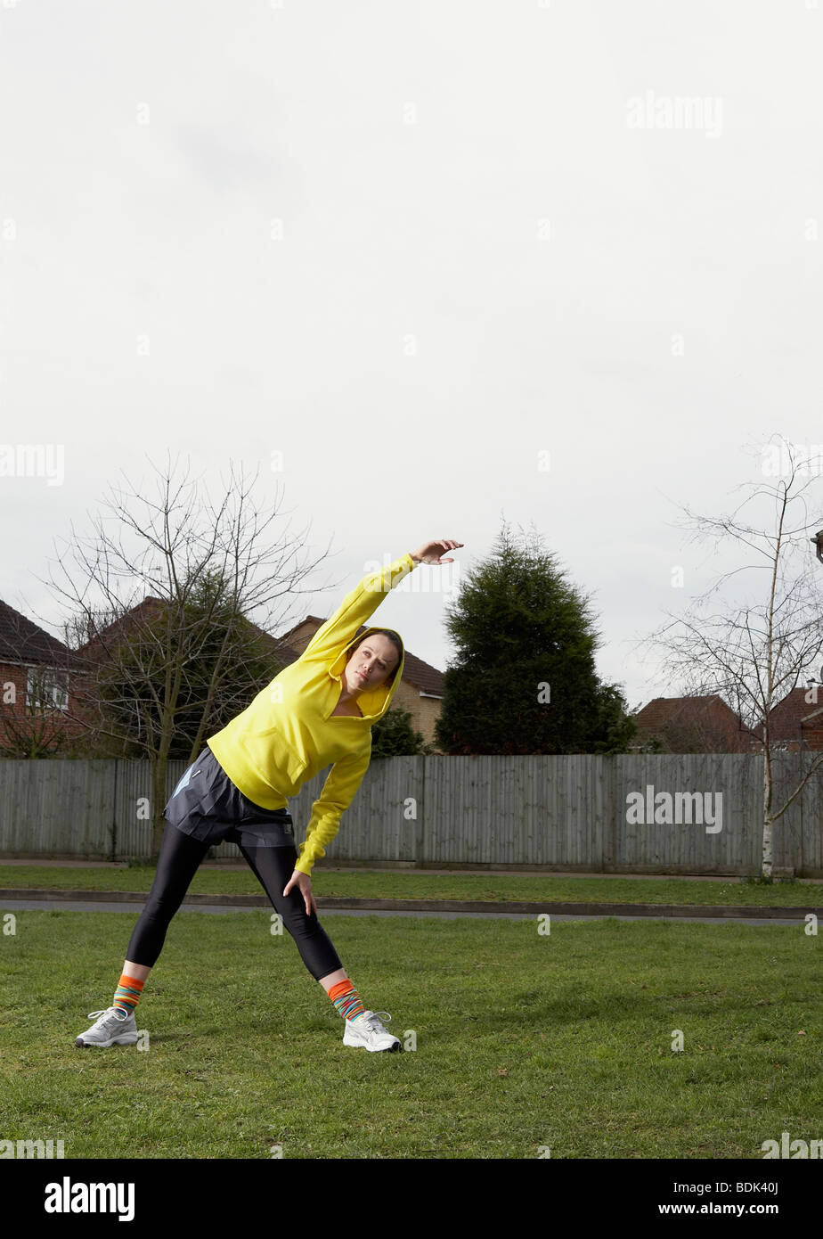 Female stretches before and after jogging Stock Photo - Alamy