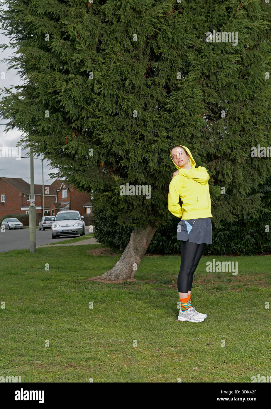 Female stretches before and after jogging Stock Photo - Alamy