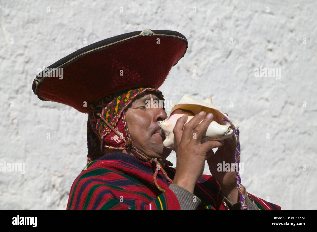 Indian people blowing conch, Chinchero, Sacred Valley, Peru Stock Photo ...