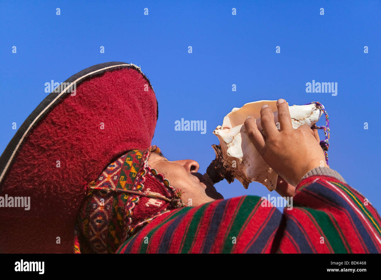 Indian people blowing conch, Chinchero, Sacred Valley, Peru Stock Photo ...