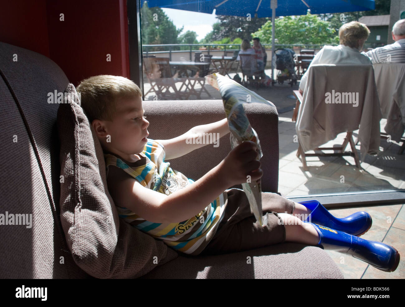 young boy reading the Daily Mirror Newspaper,boy, child, information ...