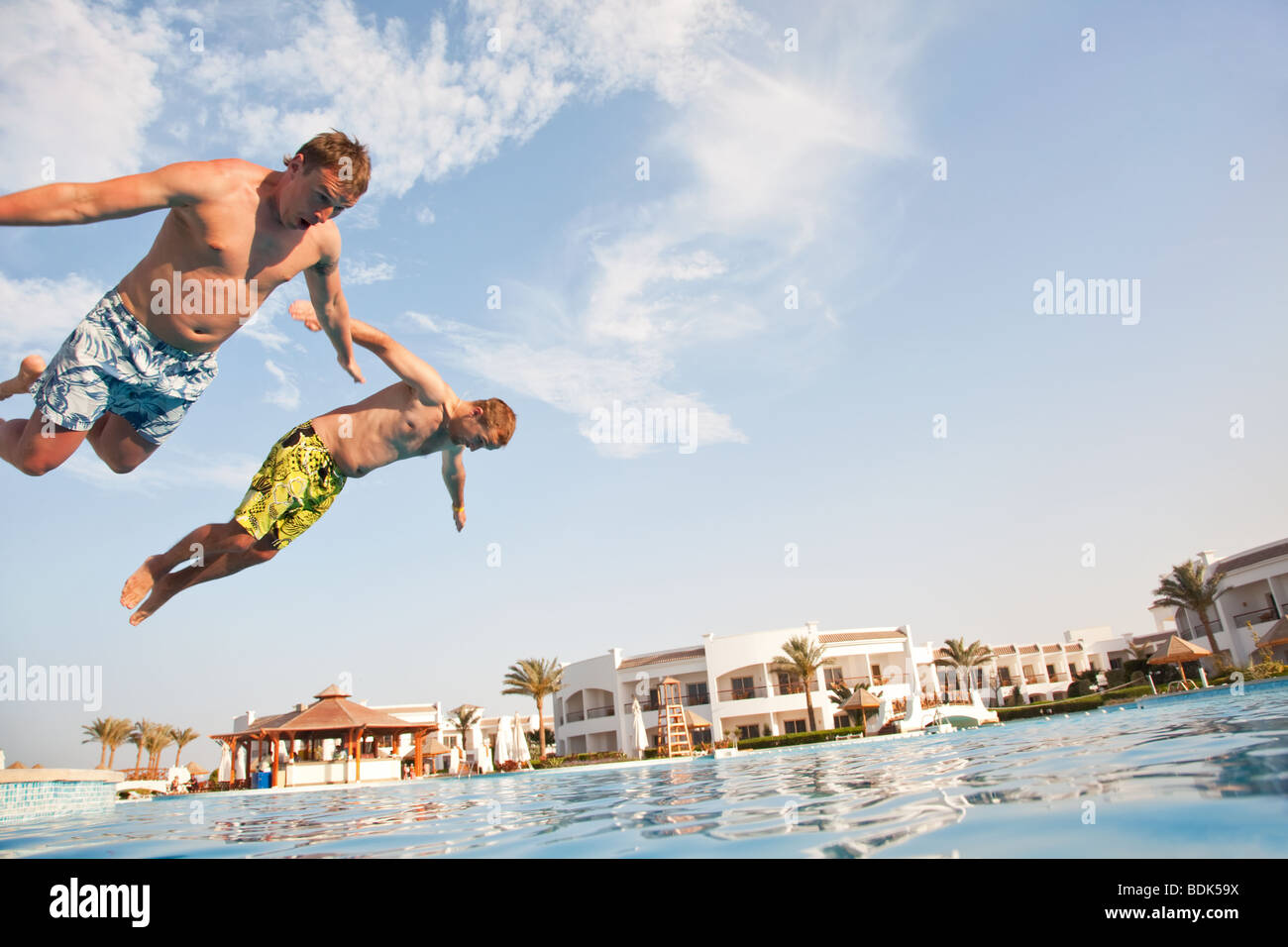 Men jumping swimming pool hi-res stock photography and images - Alamy