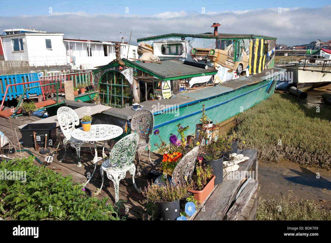 Alternative houseboat customised using materials such as Robin Reliant ...