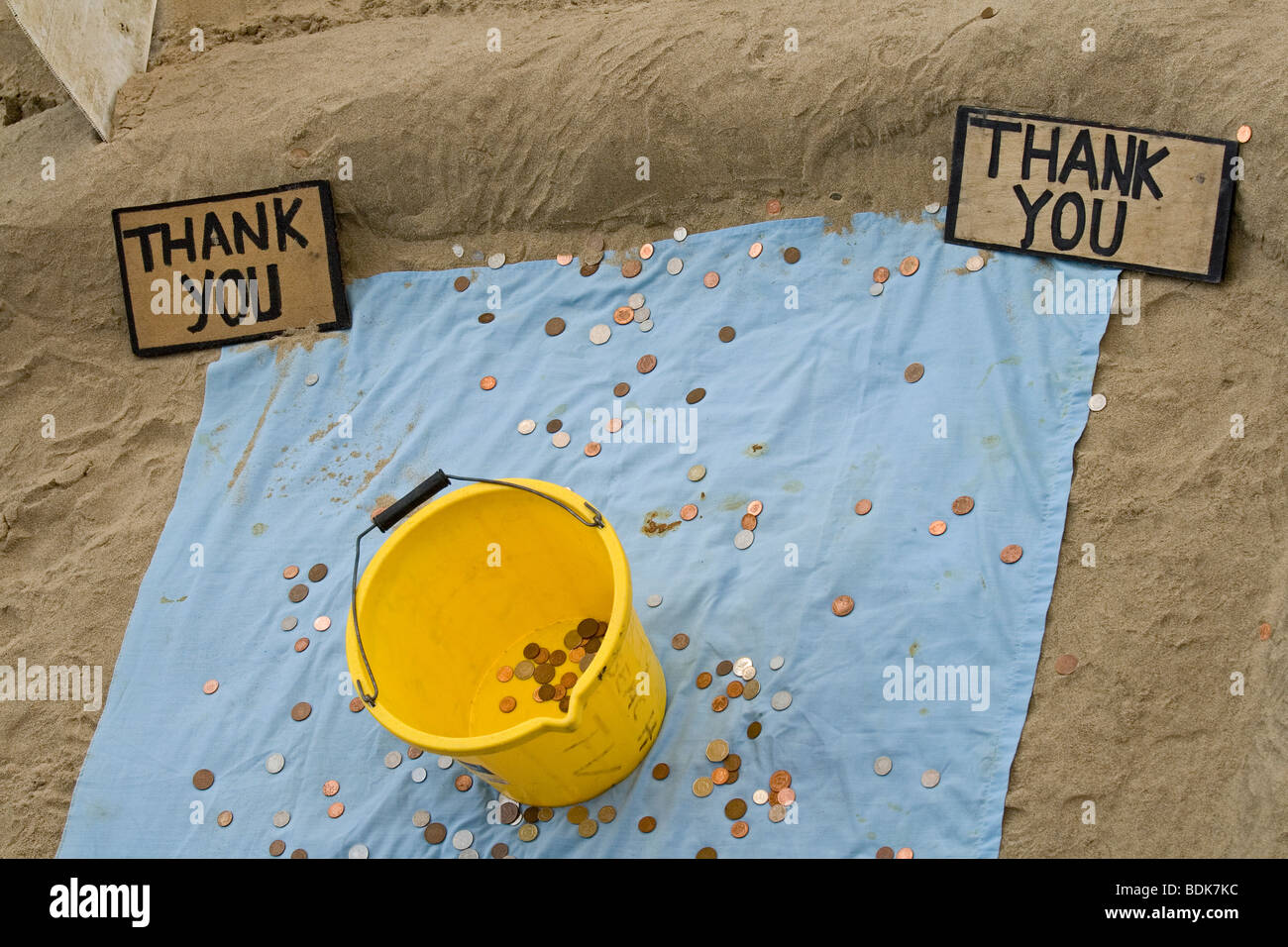 Collecting donations for sand art on the Thames bank Stock Photo - Alamy
