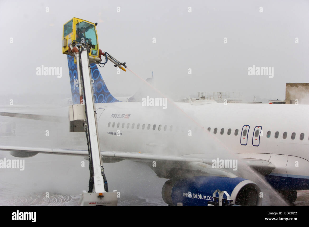 De-icing Commercial Jet after winter storm at Boston Logan intl airport ...