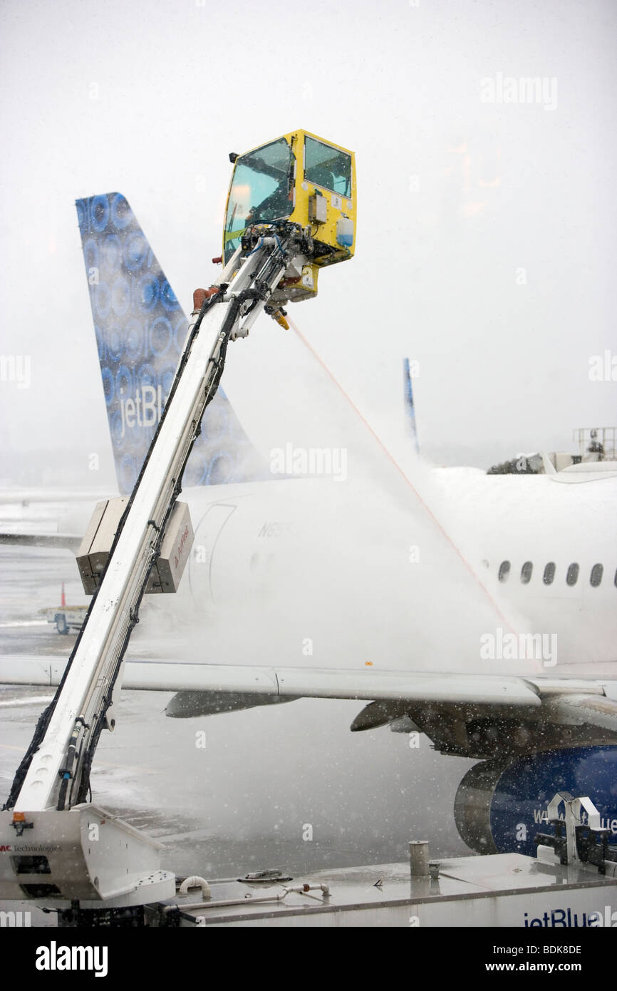 De-icing Commercial Jet after winter storm at Boston Logan intl airport ...