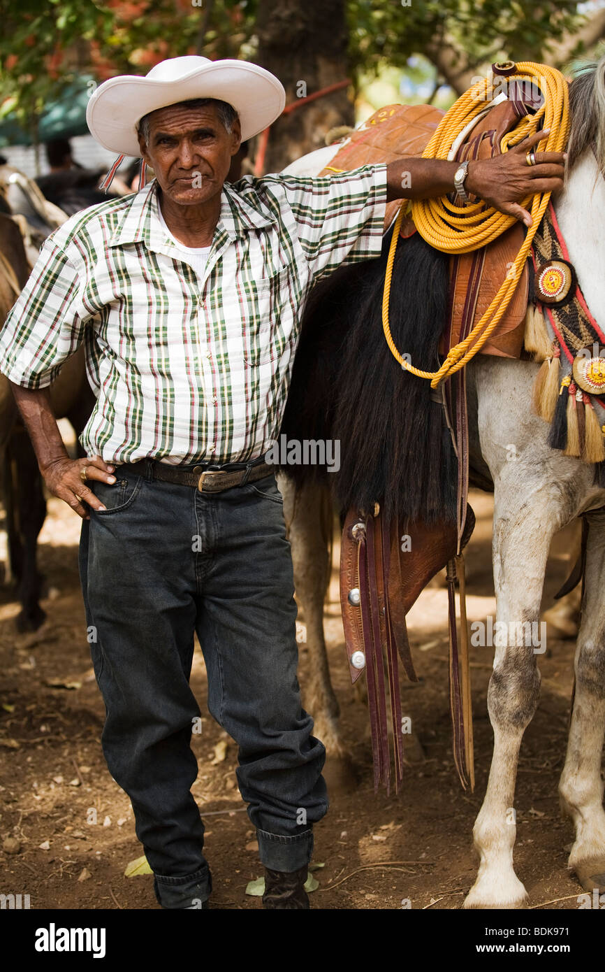 Cowboy mounting horse hi-res stock photography and images - Alamy