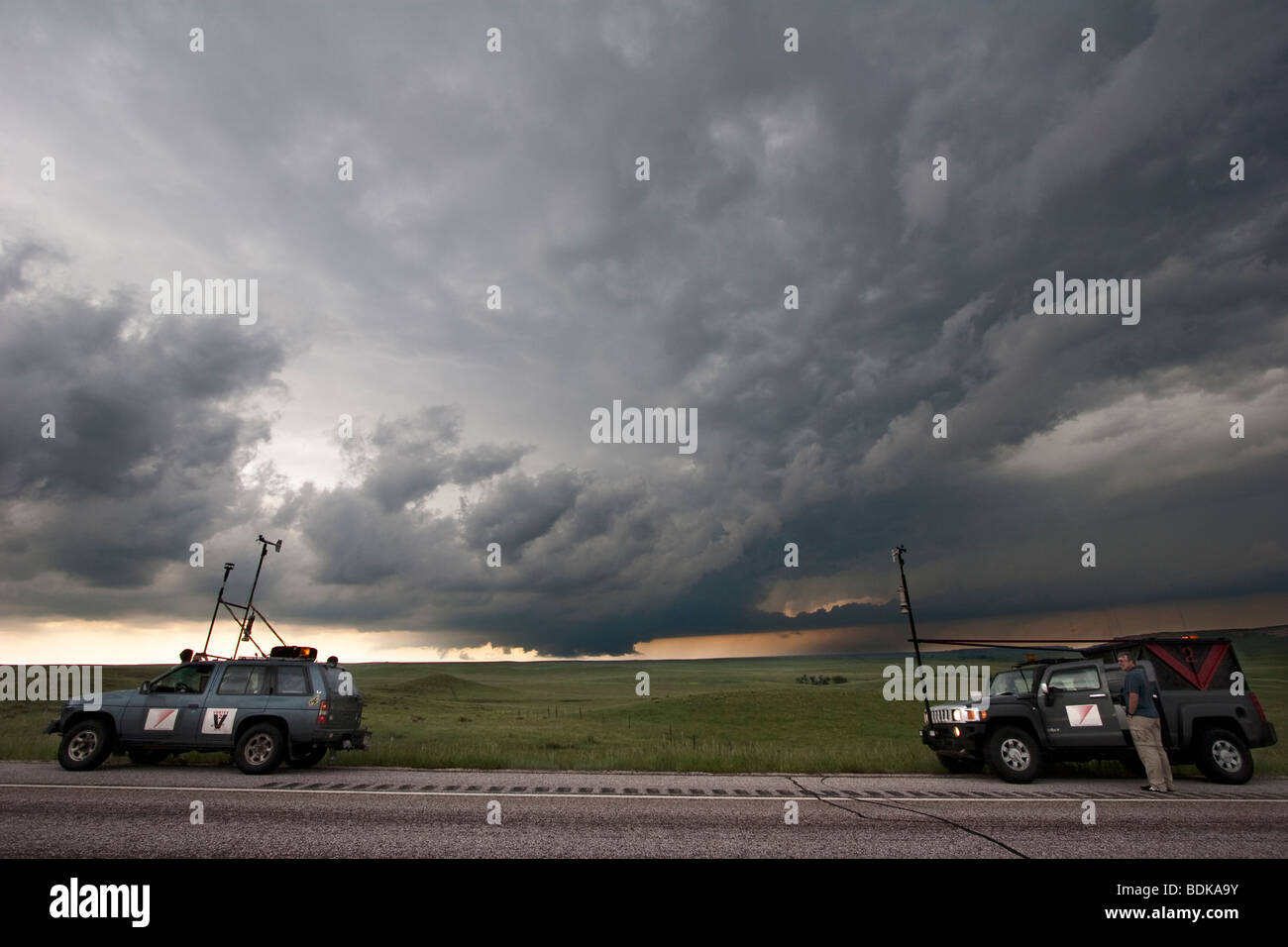 Storm chasers with Project Vortex 2 watch a distant wall cloud and ...