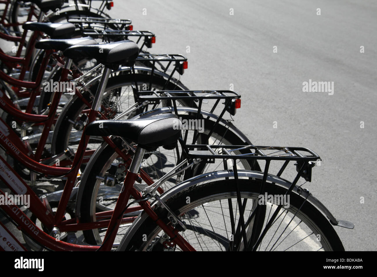 Rental bikes in street in rome hi-res stock photography and images - Alamy